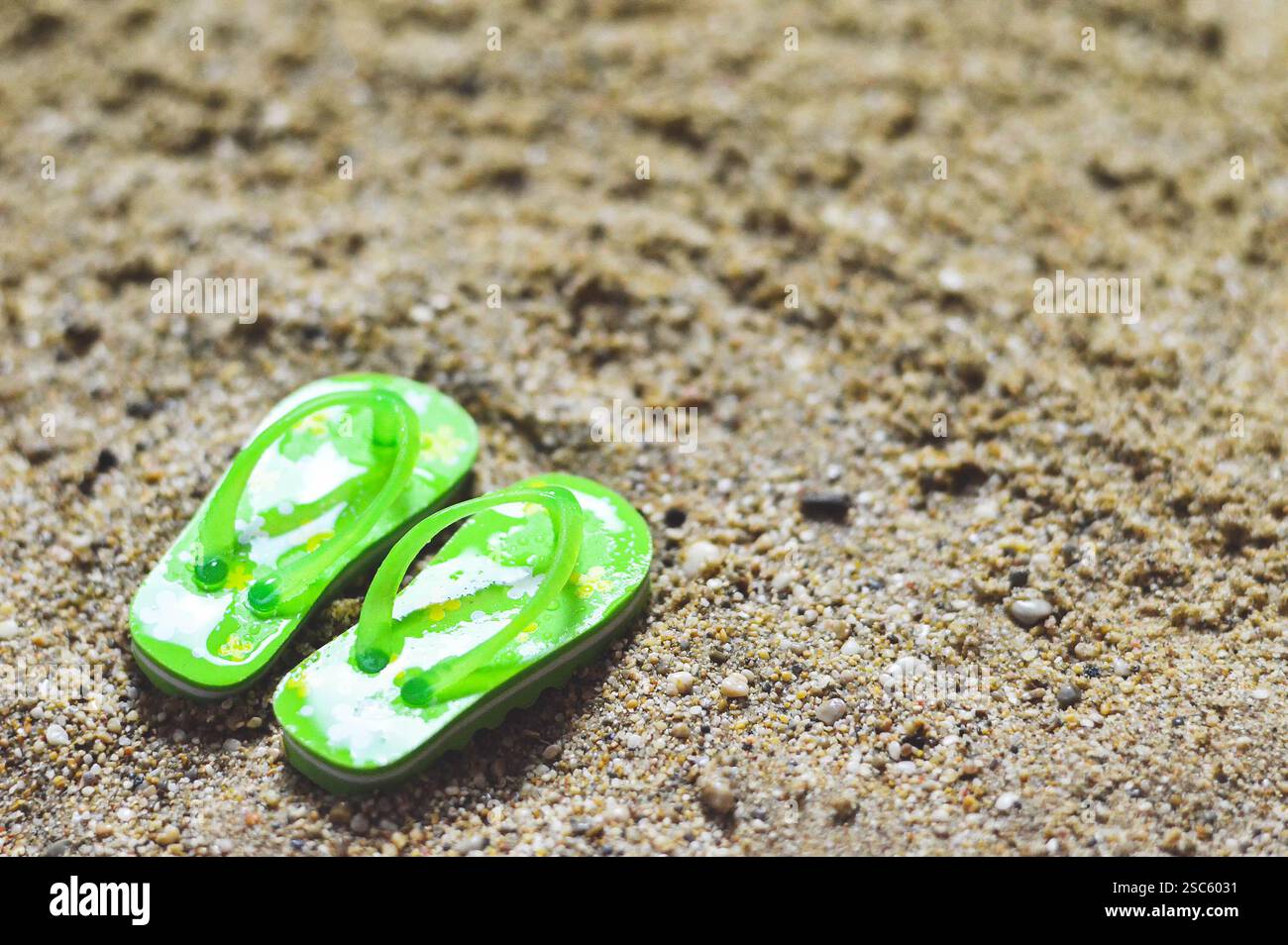 Flip flops on the beach Stock Photo - Alamy