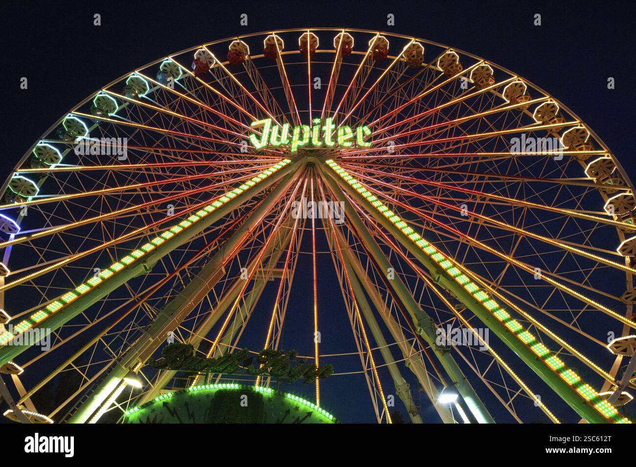 Ferris wheel illuminated at night, perspective, bright lights, many ...