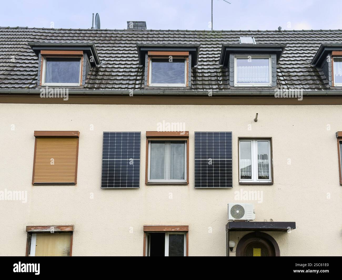 Two solar panels on the facade of an apartment block in Hilden, Germany ...
