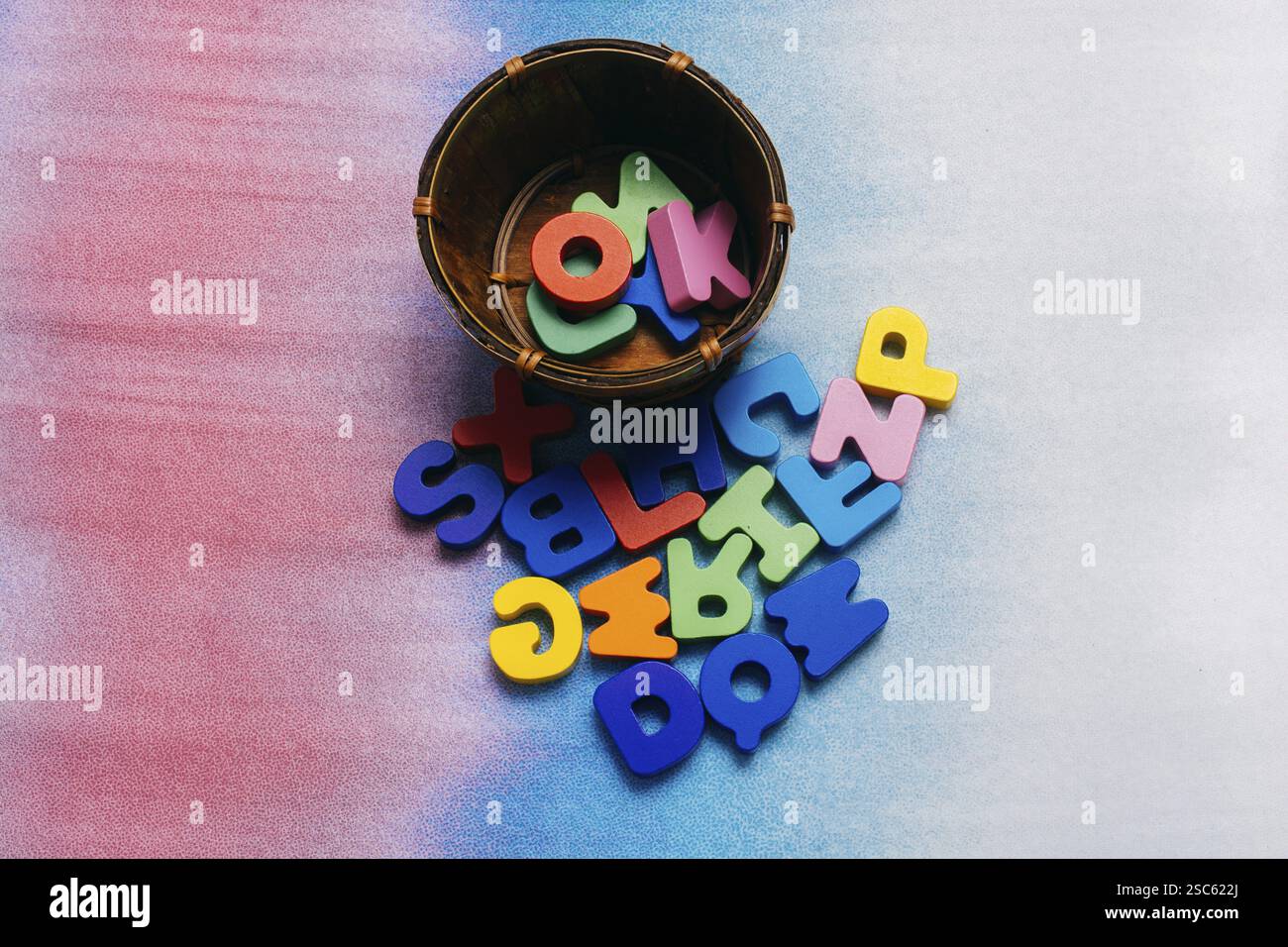 Colorful wooden letters in a container on a colorful background Stock ...