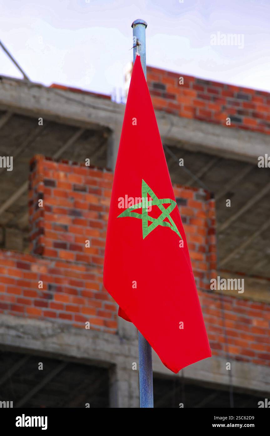 Chefchaouen, Rif Mountains, Morocco, Red Moroccan flag flies in front ...