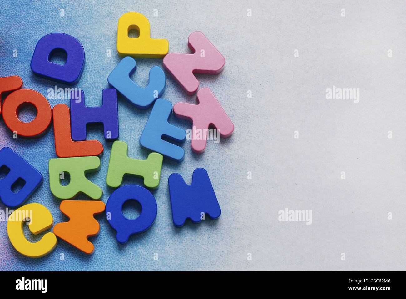 Colorful wooden letters in a container on a colorful background Stock ...