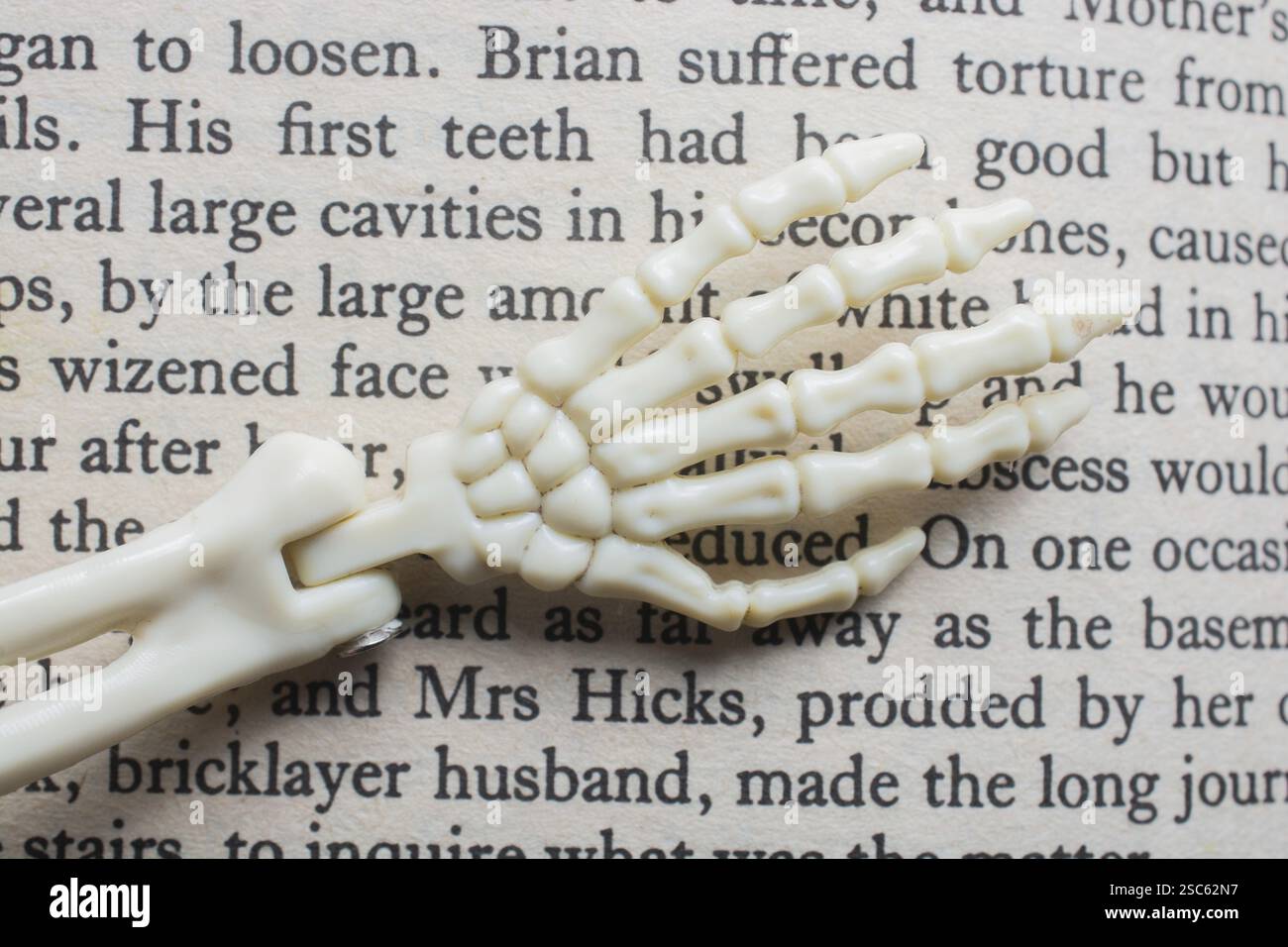 Skeletal hands book text. death, halloween and mistery concept Stock ...