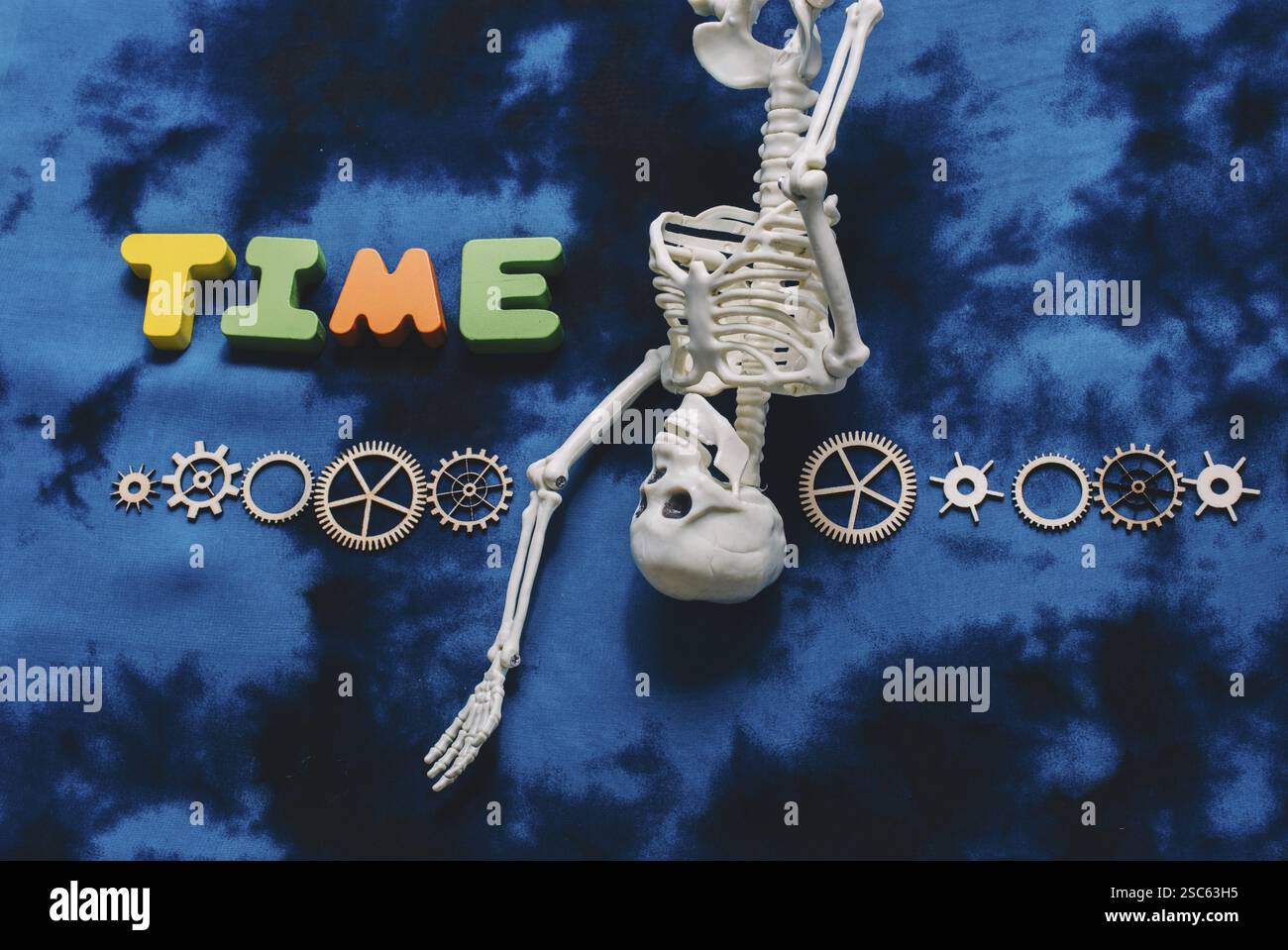 Time wording, cogwheels and artificial skeleton as time concept Stock ...