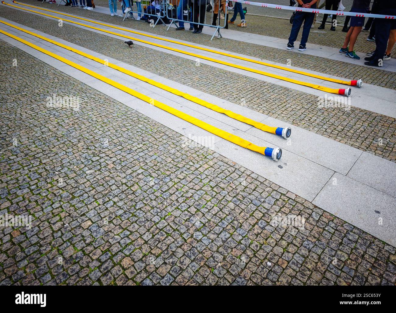 27 10 2024 - Porto, Portugal. Fire hoses on the ground at firefighters competition. Combat ...