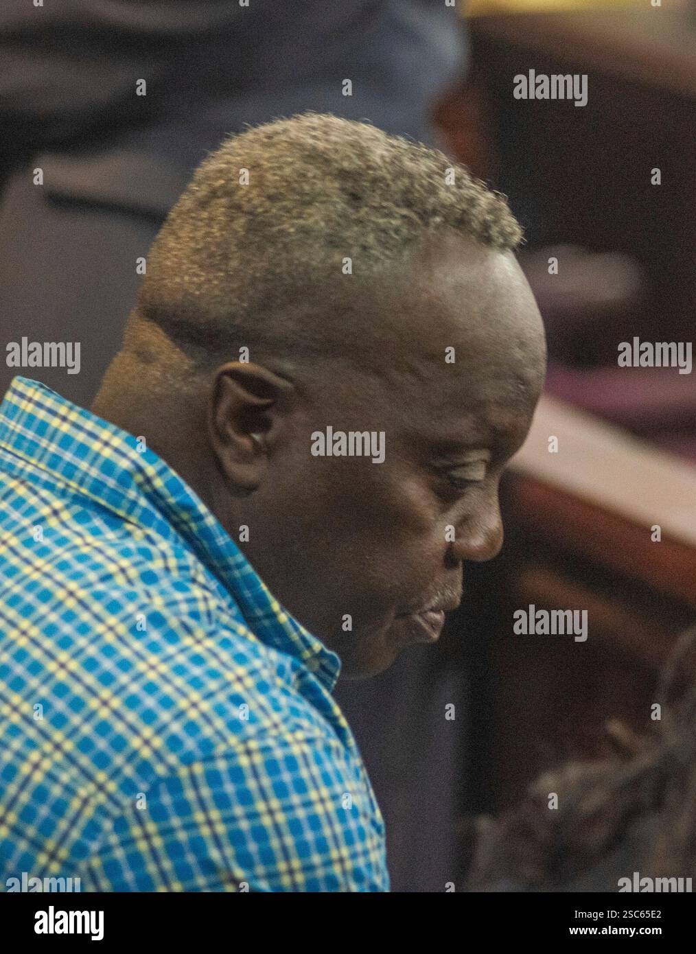 Ahmaud Arbery’s father Marcus Arbery sits in the courtroom after a ...