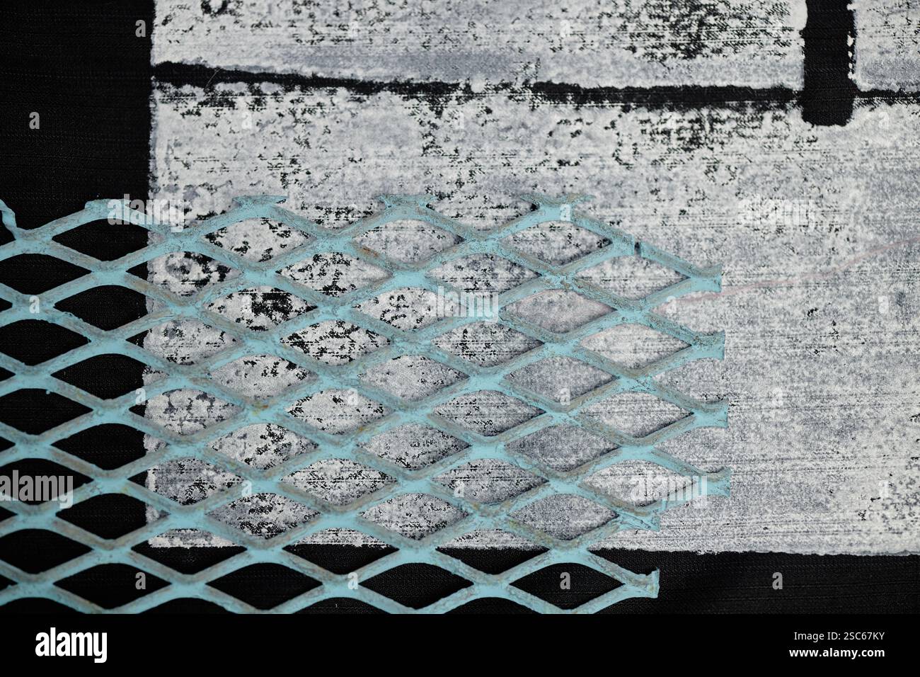 Top view of abstract collage composed from blue grid placed on black ...