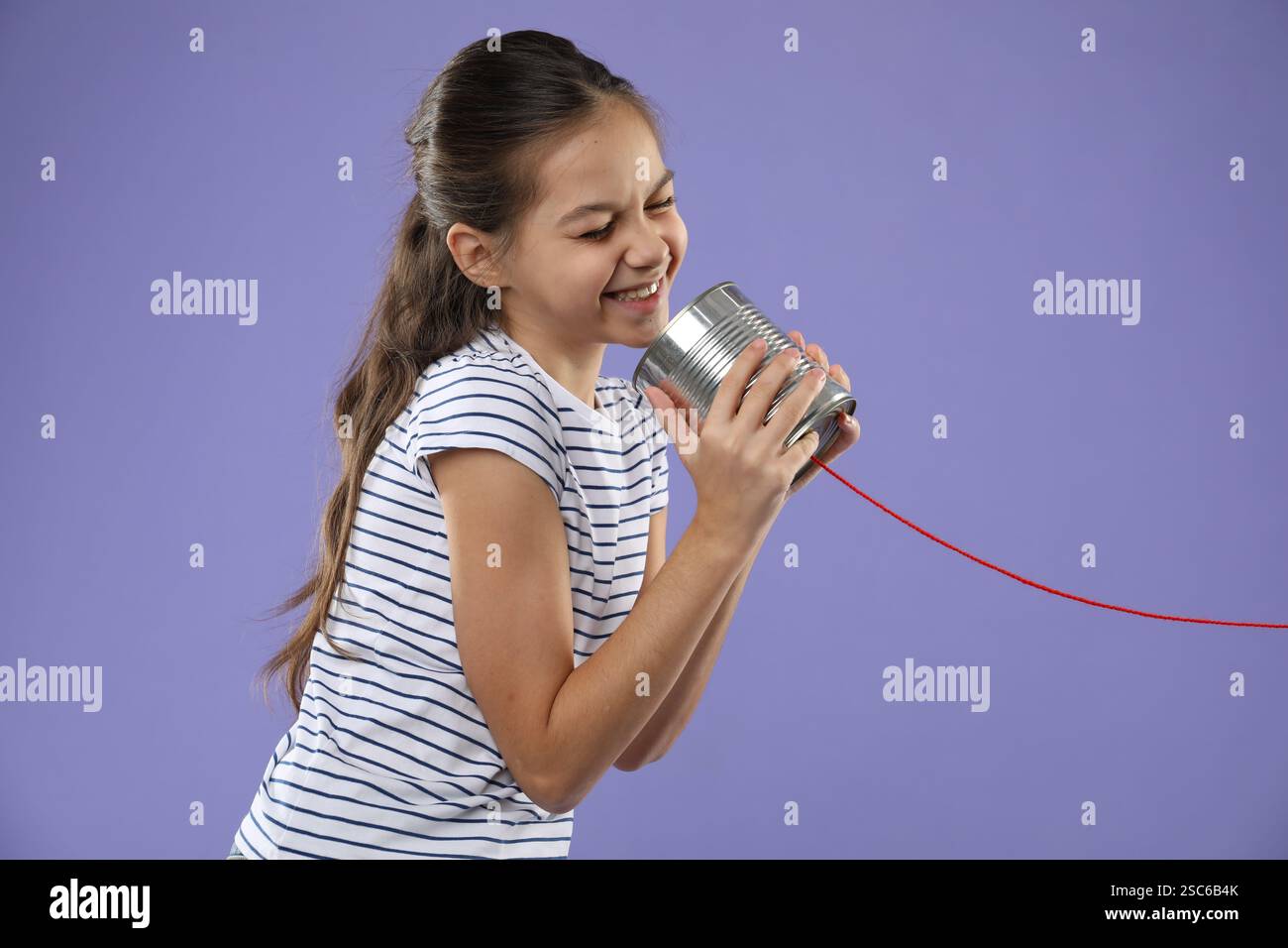 Kid using can telephone hi-res stock photography and images - Alamy