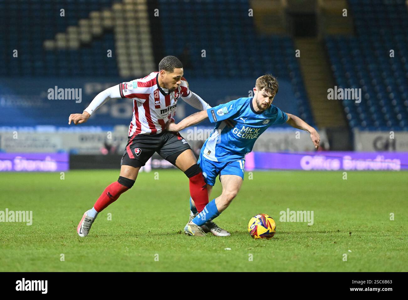 Artell Jude Boyd (2 Cheltenham Town) challenges Cian Hayes (18 ...