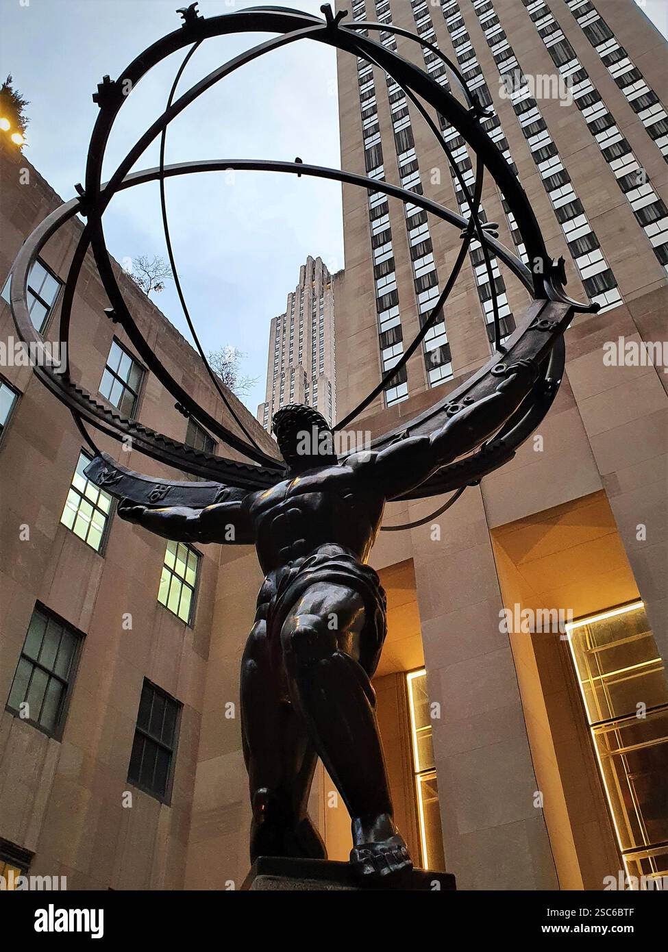 Close Up of the landmark bronze statue of Atlas carrying a globe on his ...