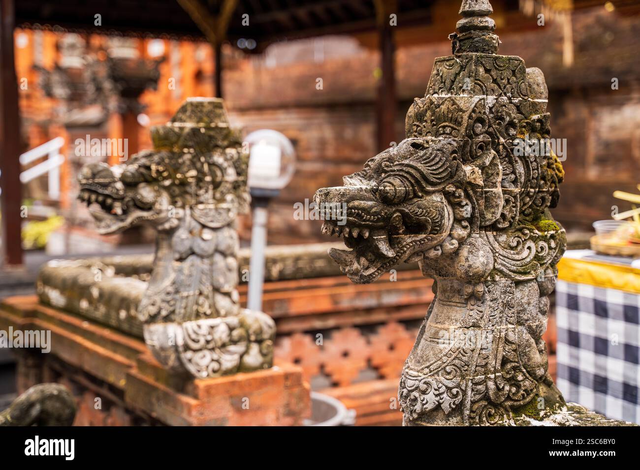 Intricate stone carvings of mythical creatures adorn a traditional ...