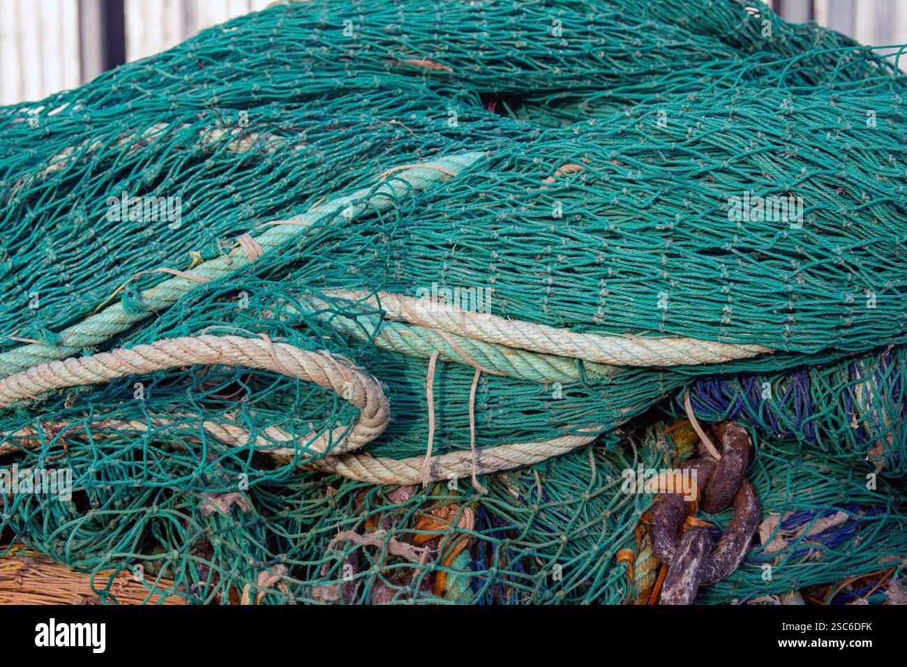 Green Fishing Nets with Ropes and Chains Stock Photo - Alamy