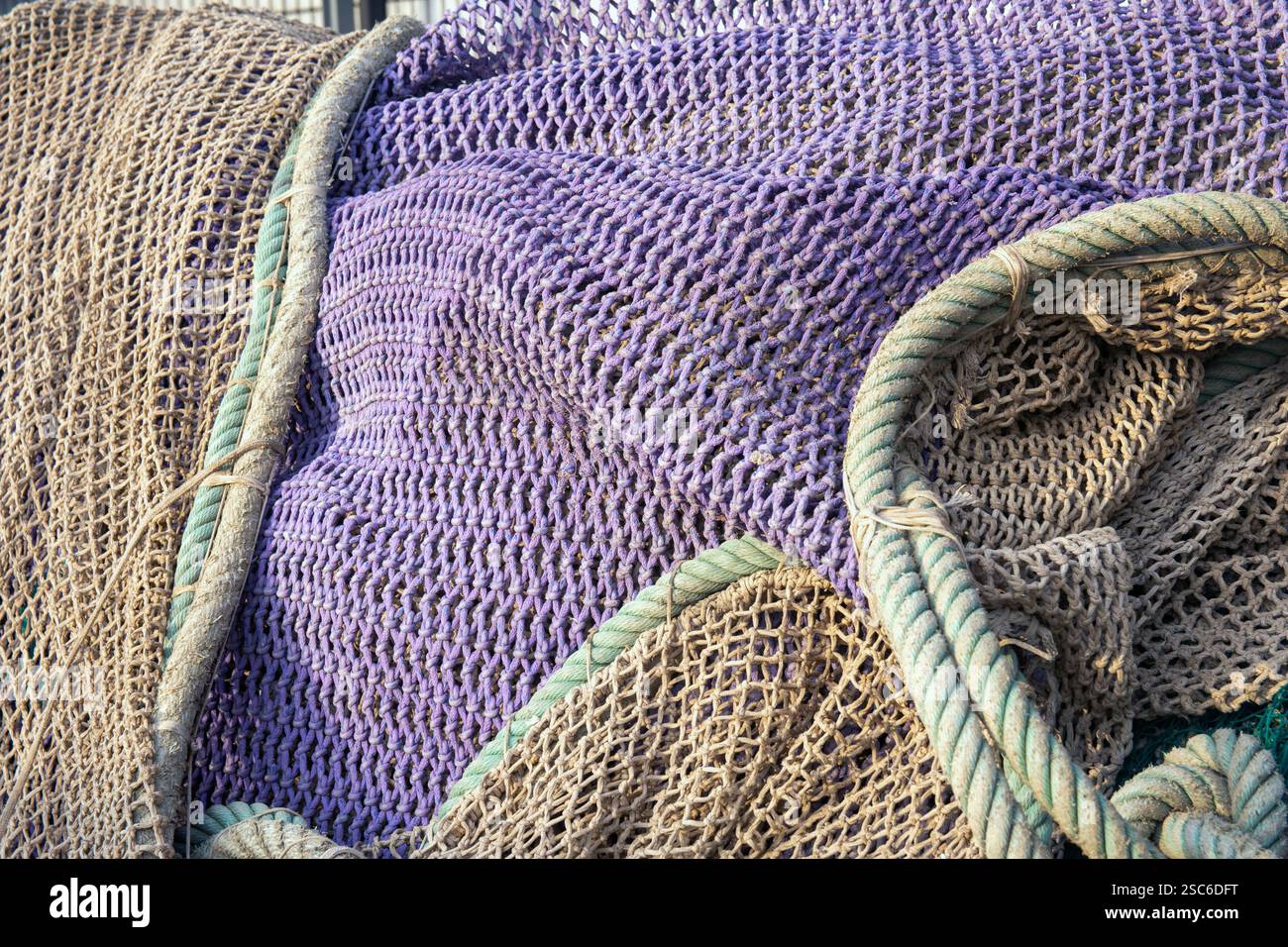 Pile of Purple and Beige Fishing Nets Stock Photo - Alamy