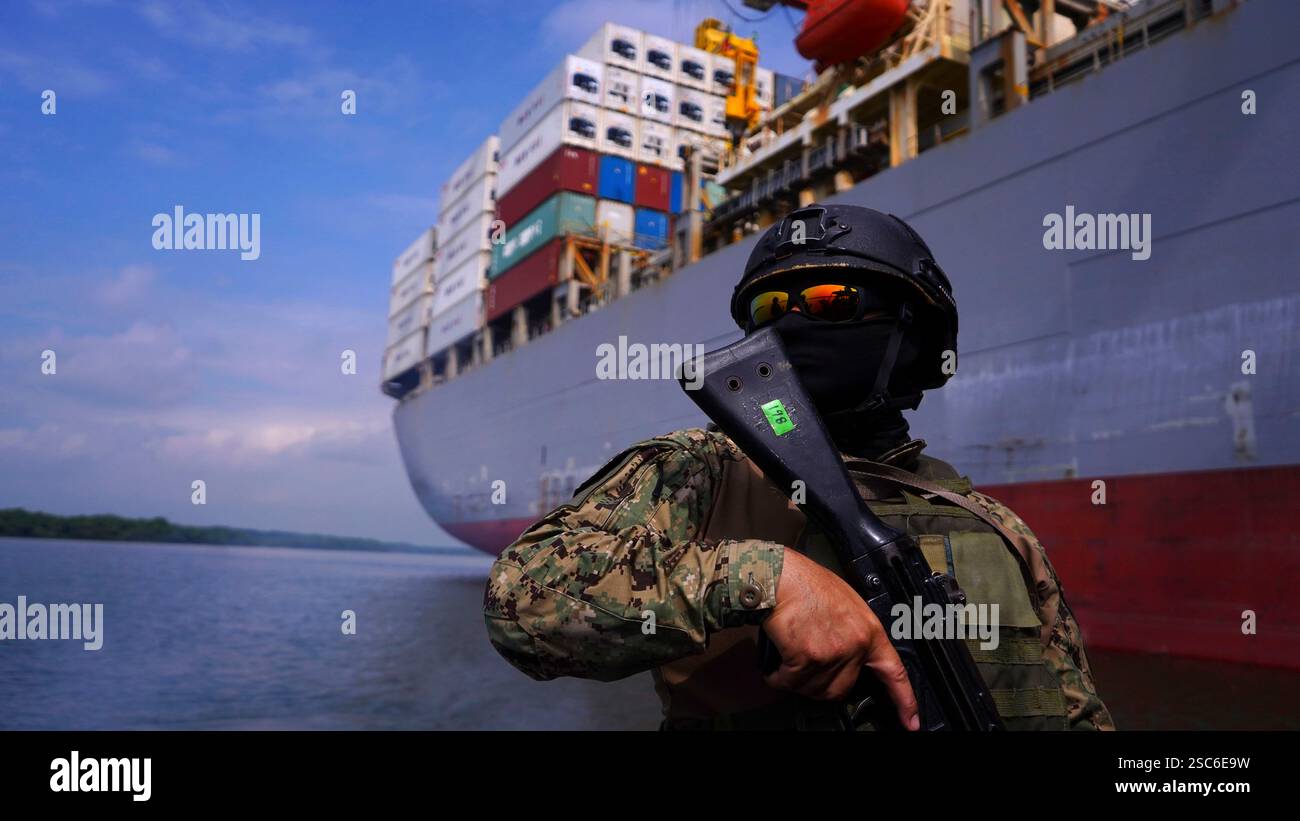 A soldier stands guarding an area of the Contecon sea port in Guayaquil ...
