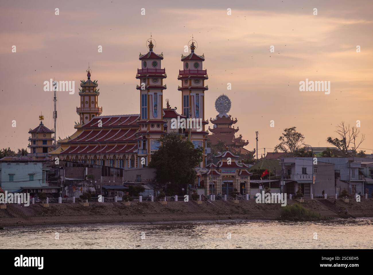 Cao Dai Temple on the Mekong River at sunset, Tan Chau, An Giang ...