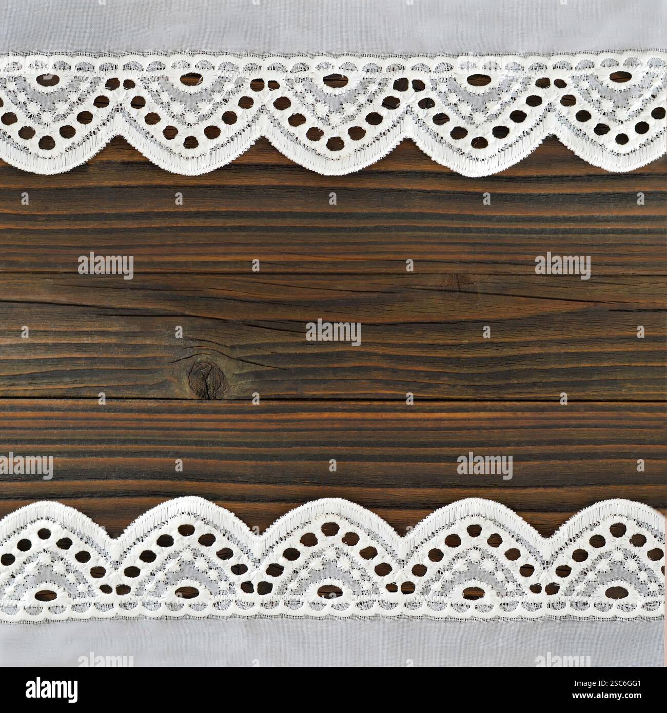 Wooden background with borders of embroidered lace Stock Photo - Alamy