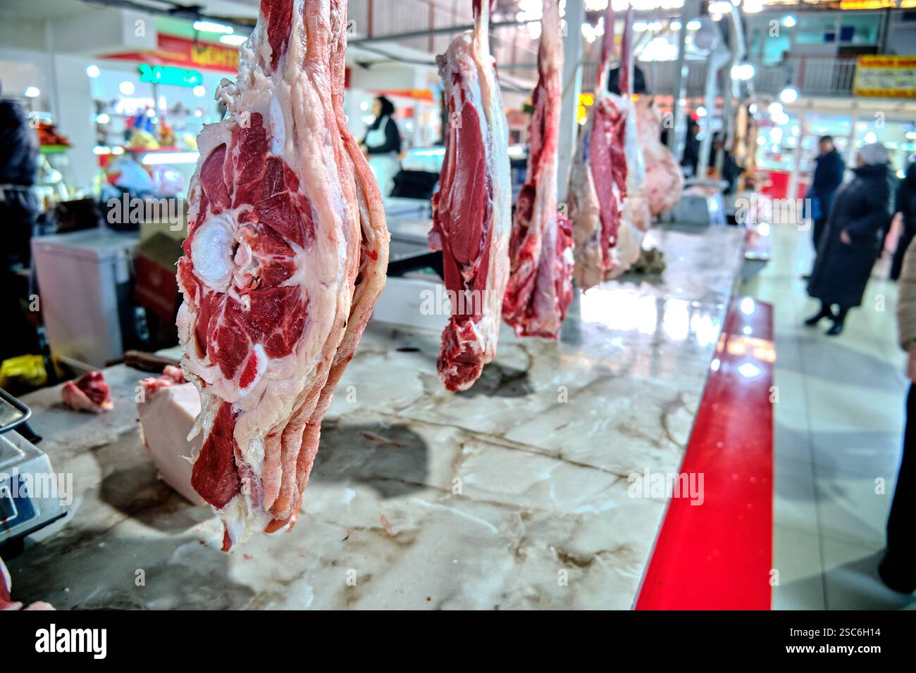 A meat market stall with hanging lamb meat Stock Photo - Alamy