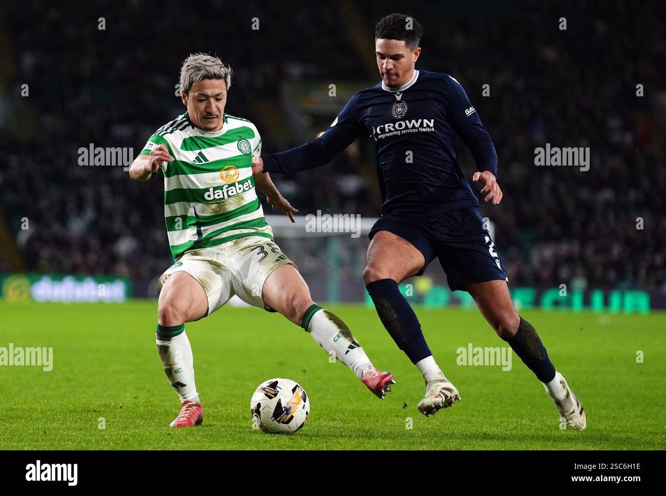 Celtic's Daizen Maeda and Dundee's Ethan Ingram (right) battle for the ...
