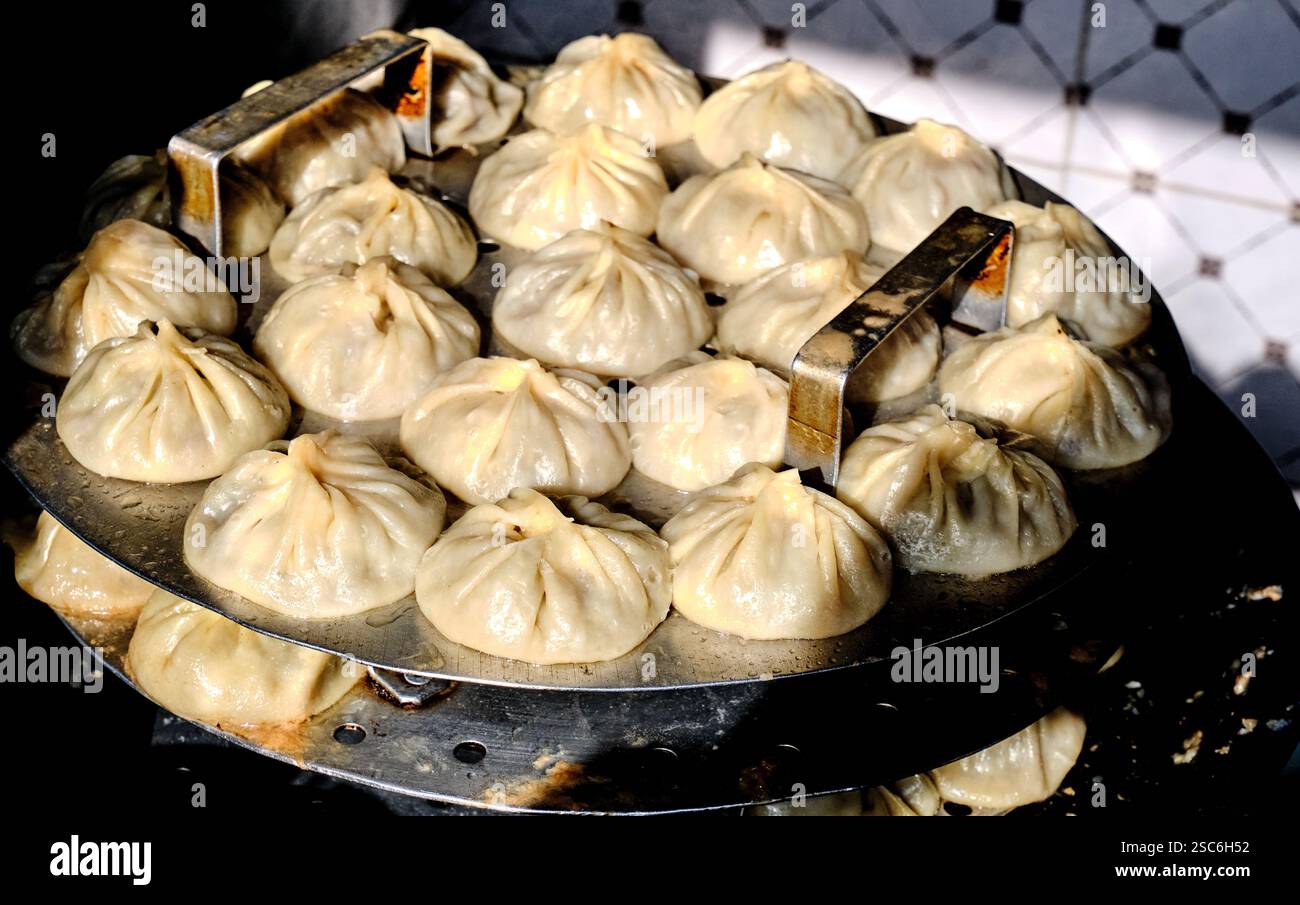 The image shows manty, a traditional dish of Central Asian cuisine ...