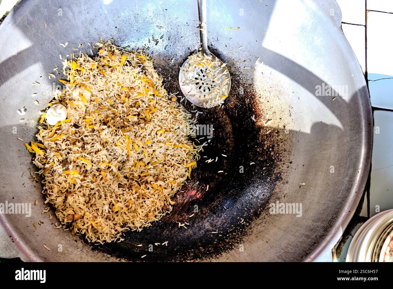 A dish of plov cooked in a large cast-iron pot called a kazan Stock ...