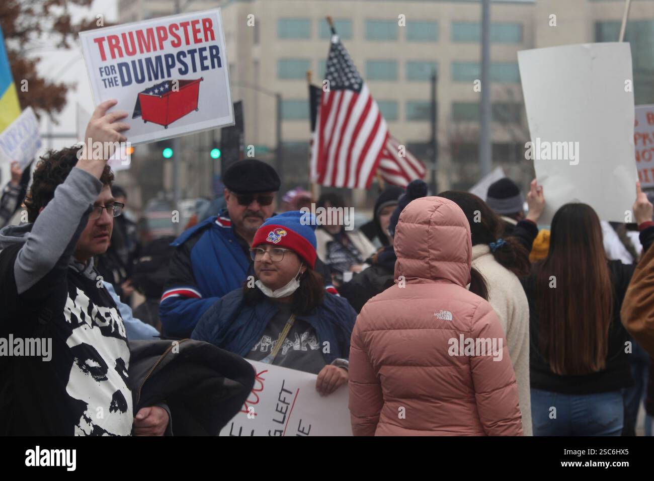 About 100 people rally after marching around the perimeter of the ...