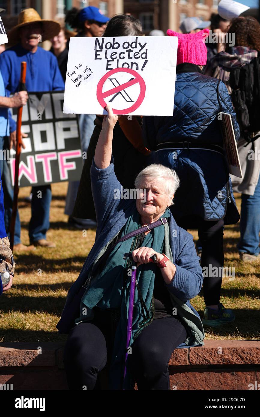 A participant holds up a placard during a political protest outside the ...