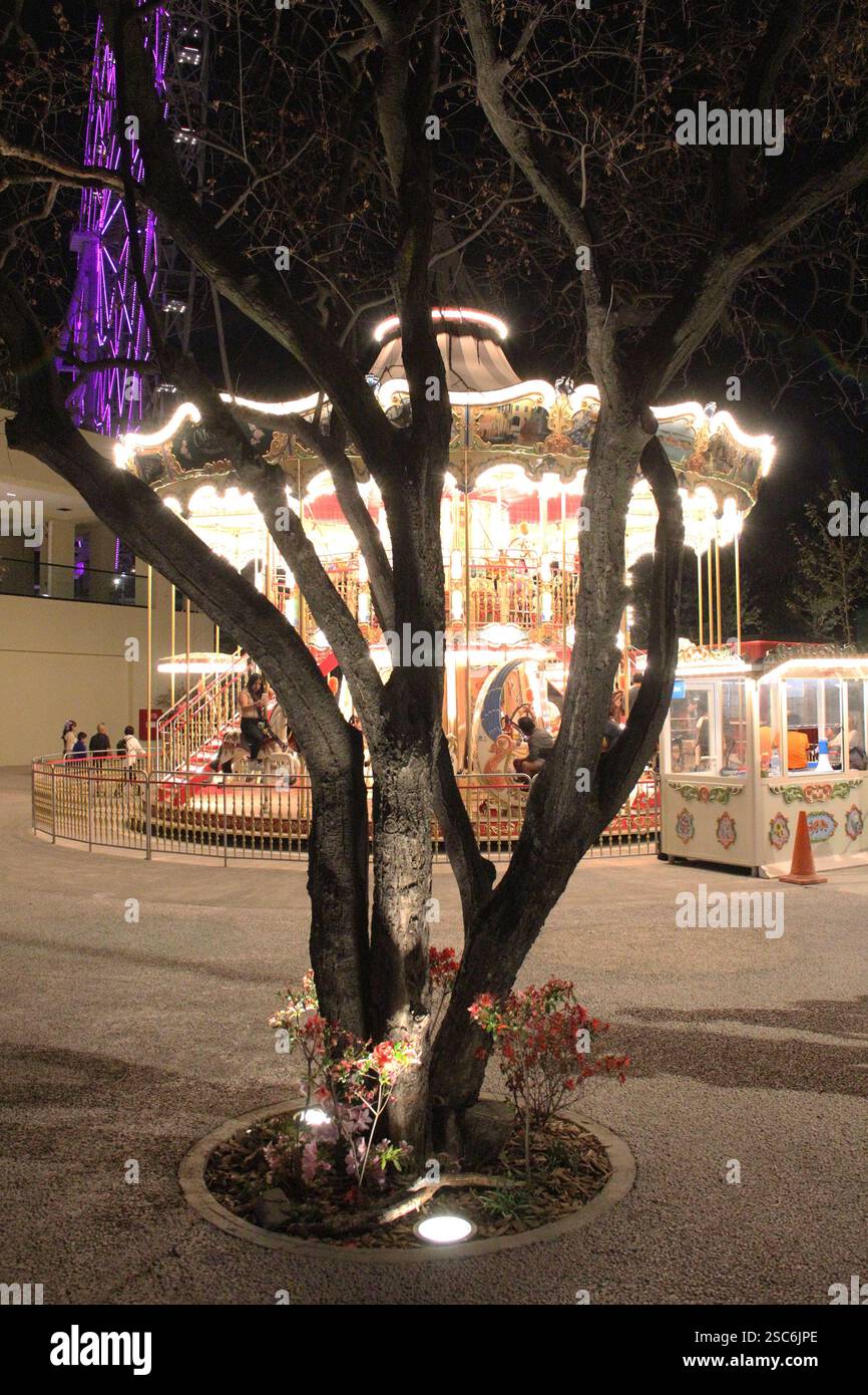 Mexico City, Mexico - Mar 20 2024: Two-story carousel with moving rides ...