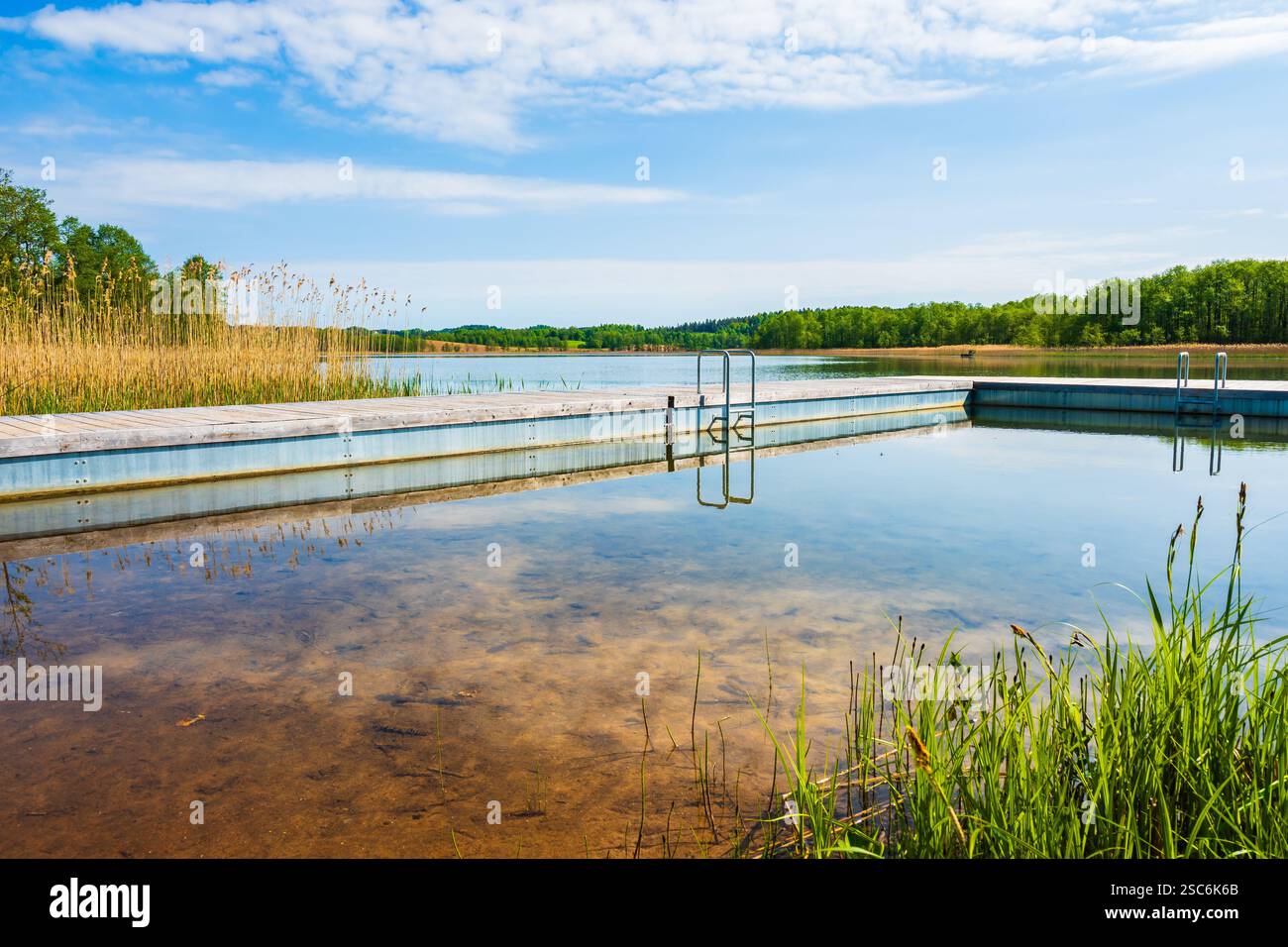 Wooden pier and beach on shore of beautiful Wigry lake, Wigry National ...