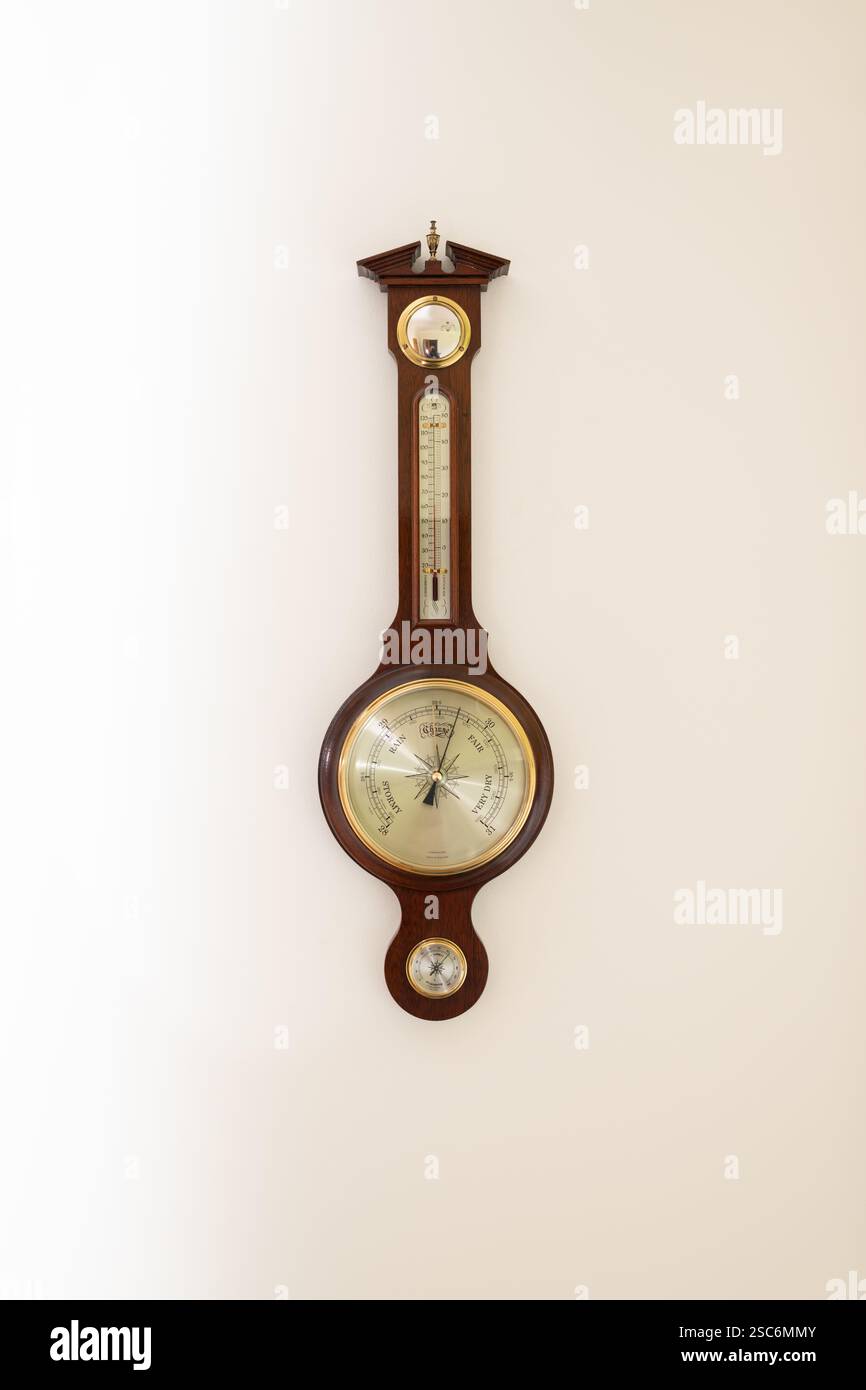 Close up of an aneroid barometer mounted on a wall Stock Photo - Alamy
