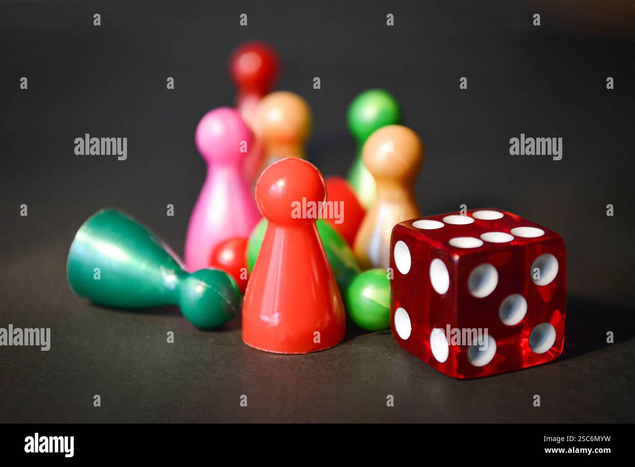 Board game figures and dice Stock Photo - Alamy