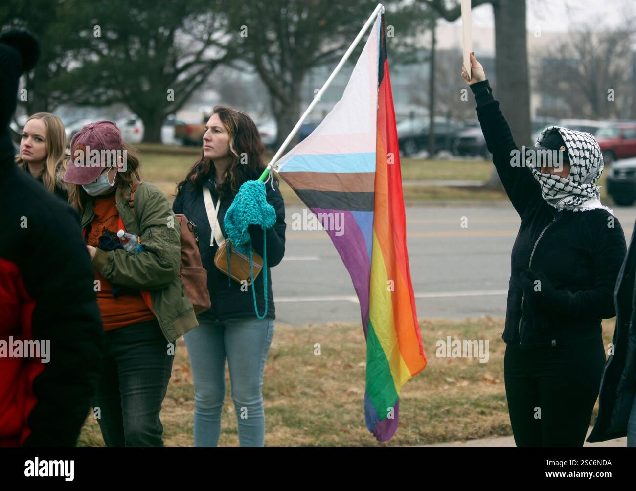 Sammy Sargent, a Topeka, Kansas, educator, holds an LGBTQ+ rights flag ...