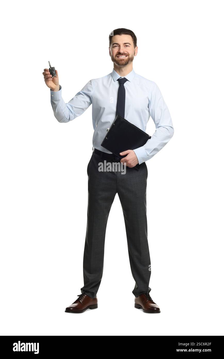 Cheerful salesman with car key and clipboard on white background Stock ...