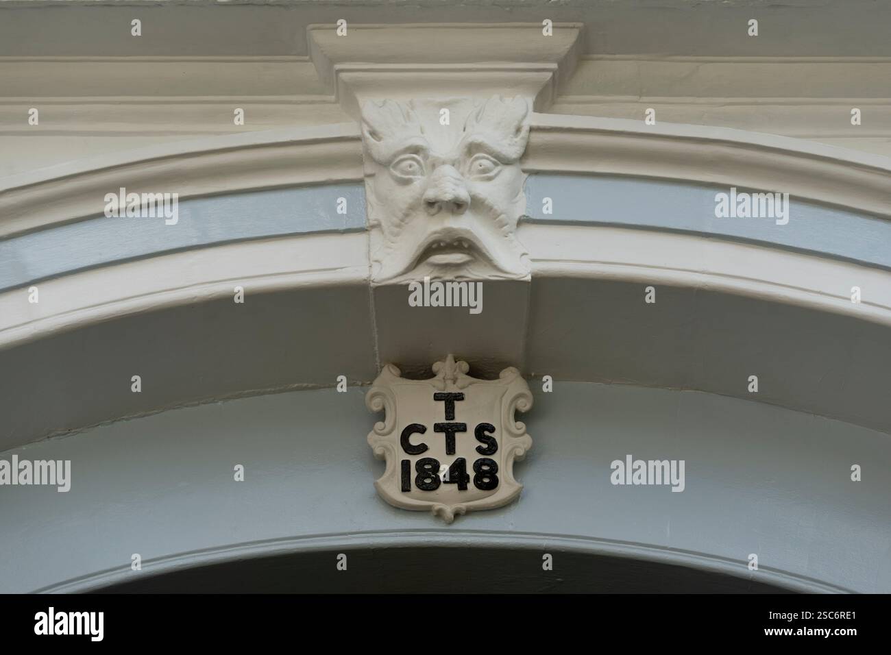 Architectural detail, likely a building facade, showing a grotesque ...