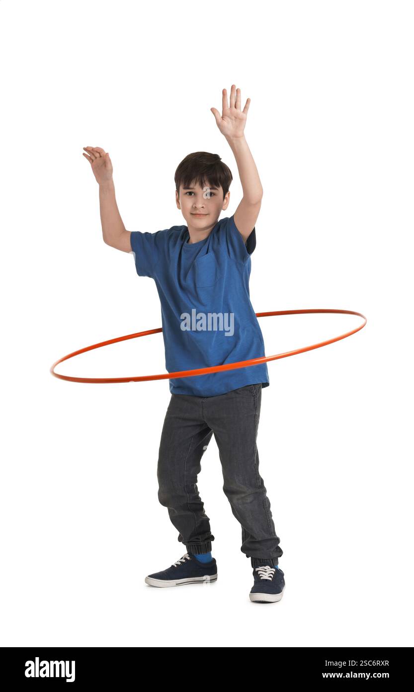 Boy exercising with hula hoop on white background Stock Photo - Alamy