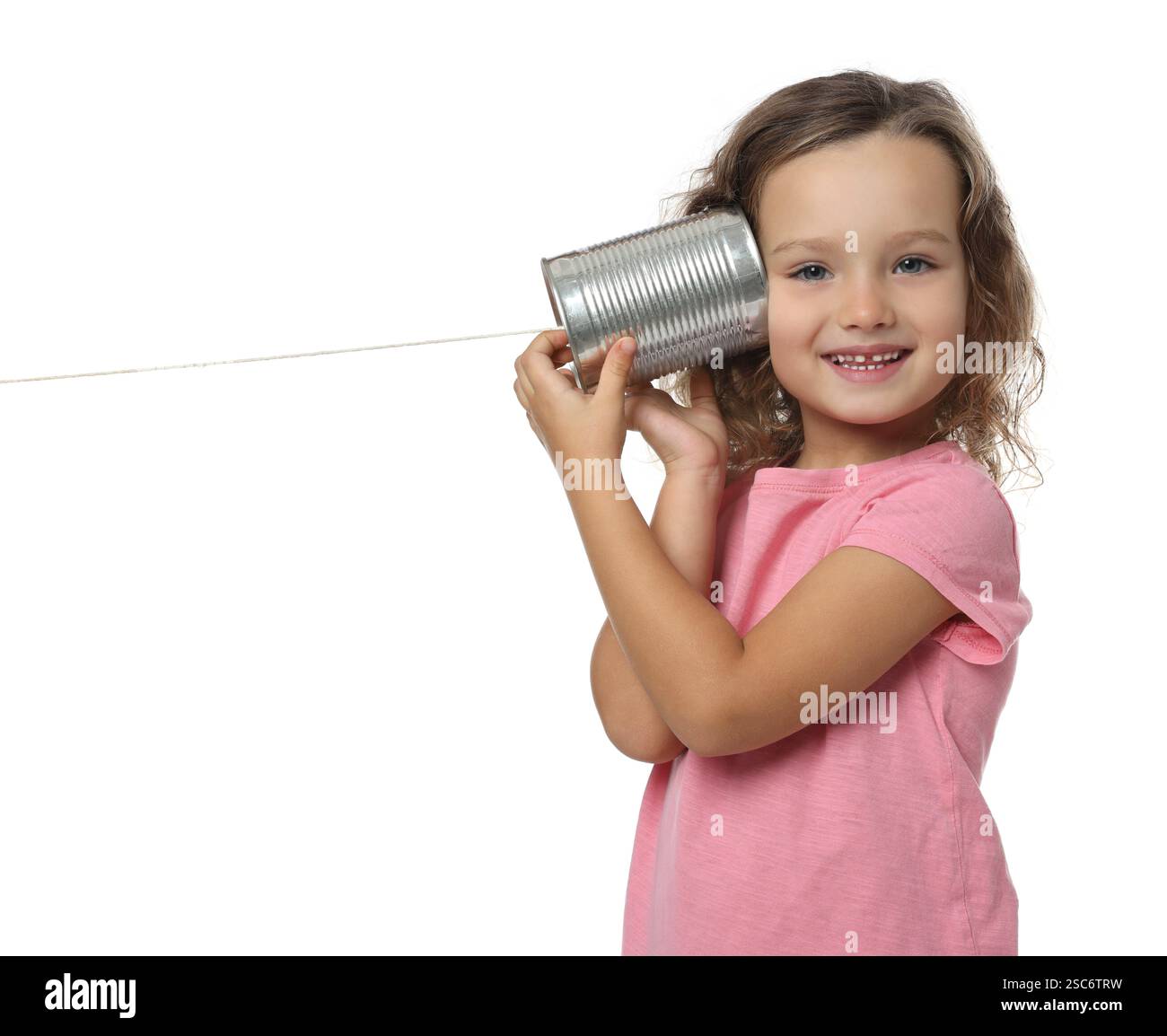 Girl using tin can telephone on white background Stock Photo - Alamy