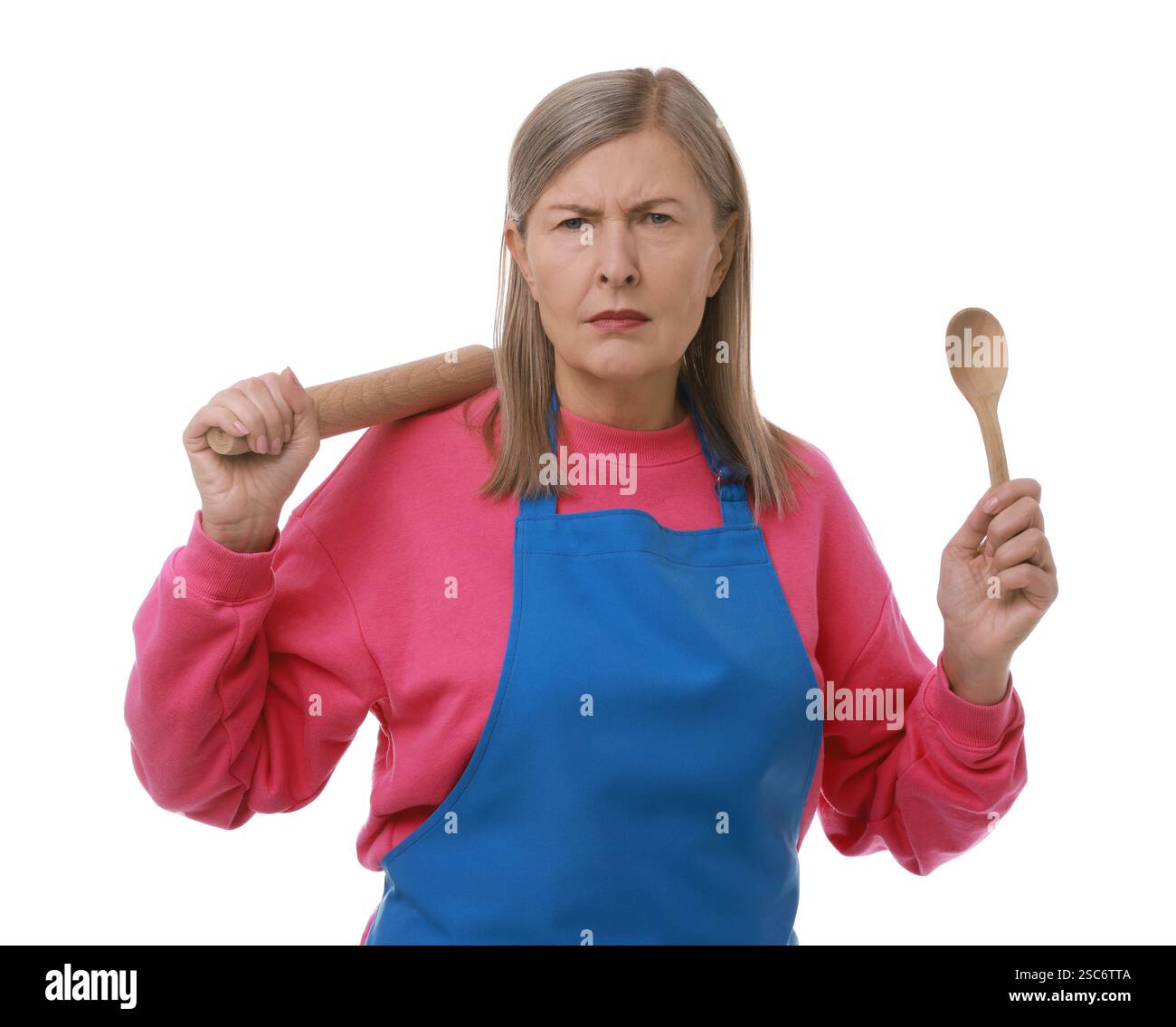 Angry woman with rolling pin and spoon on white background Stock Photo ...