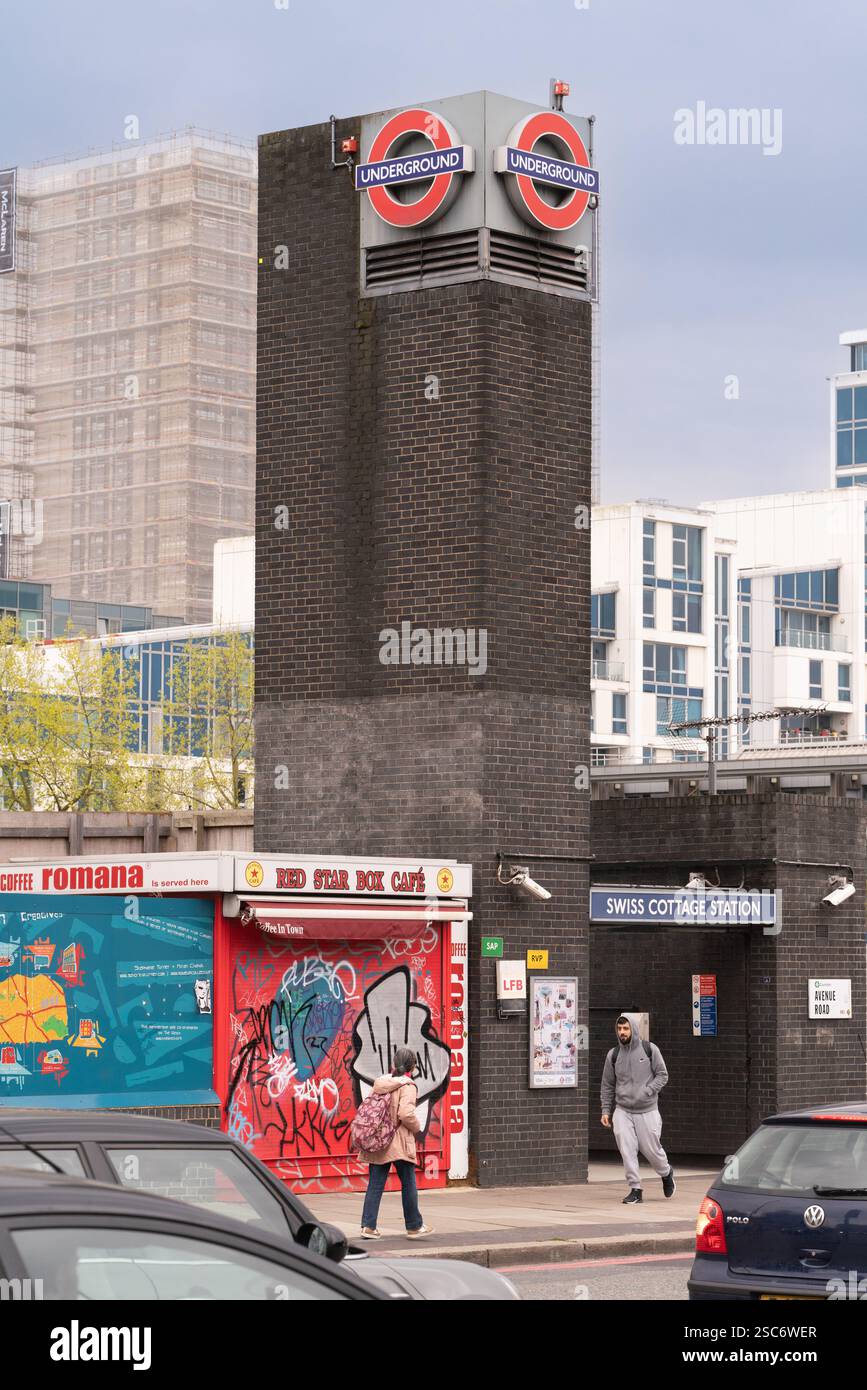 Pedestrians at Swiss Cottage London Underground station. Construction ...