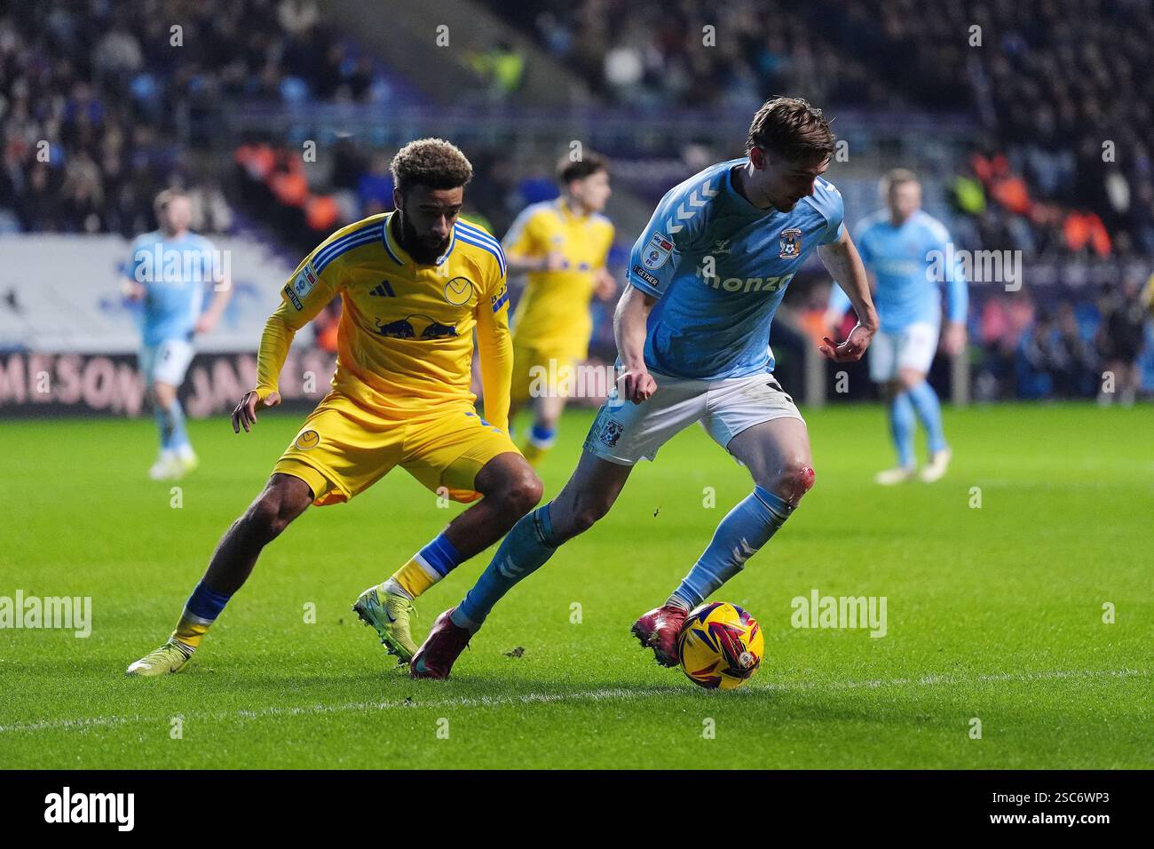 Coventry City's Jack Rudoni (right) and Leeds United's Jayden Bogle ...