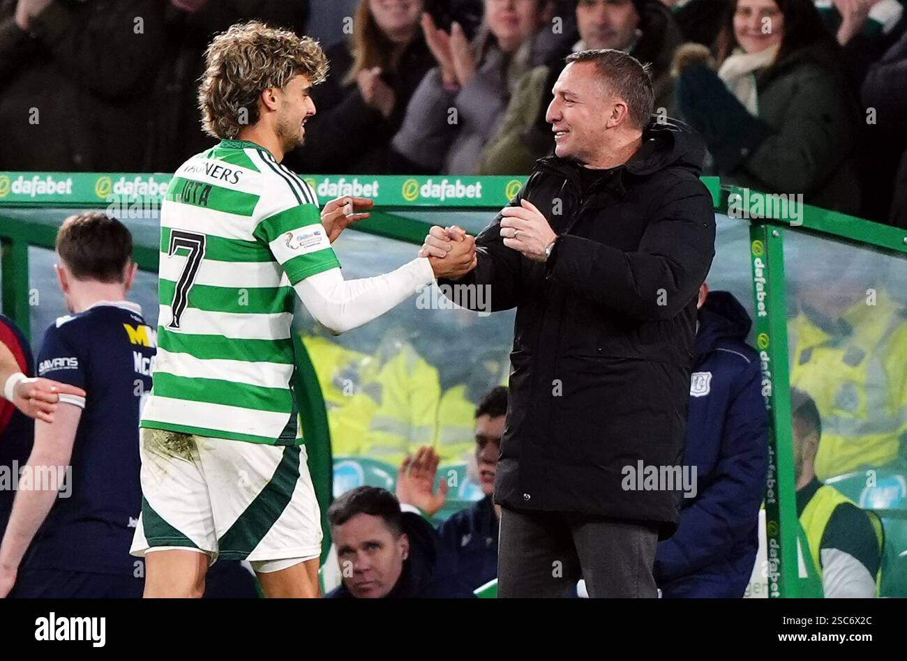 Celtic's Jota with manager Brendan Rodgers after being substituted ...