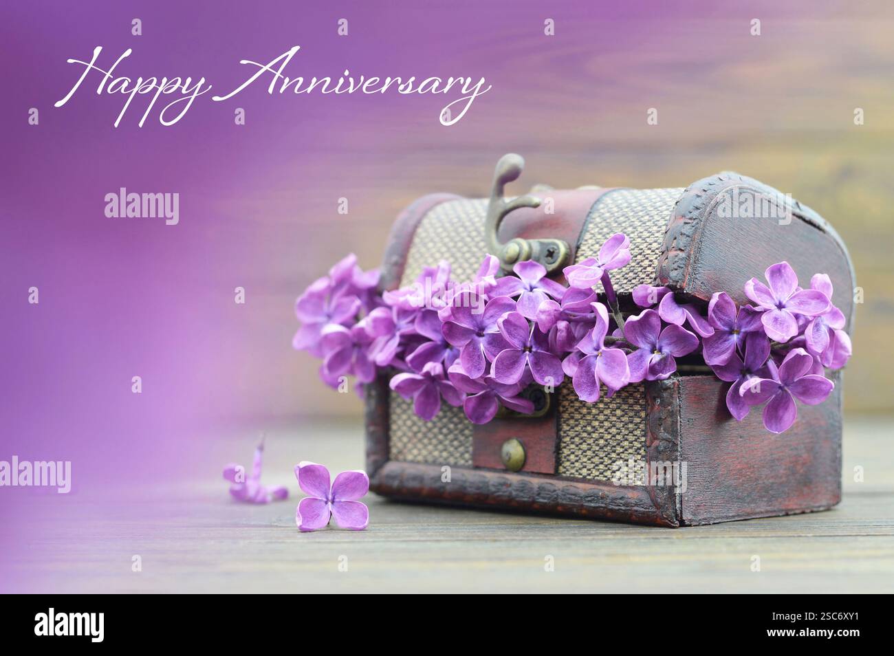 Anniversary card with violet lilac flowers in wooden chest Stock Photo ...