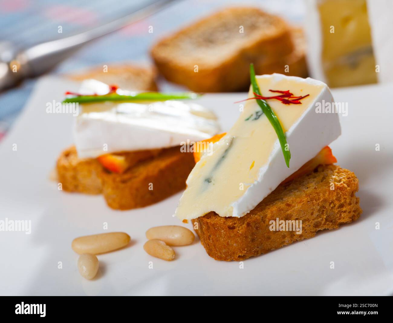 Canape with orange and blue cheese Stock Photo - Alamy