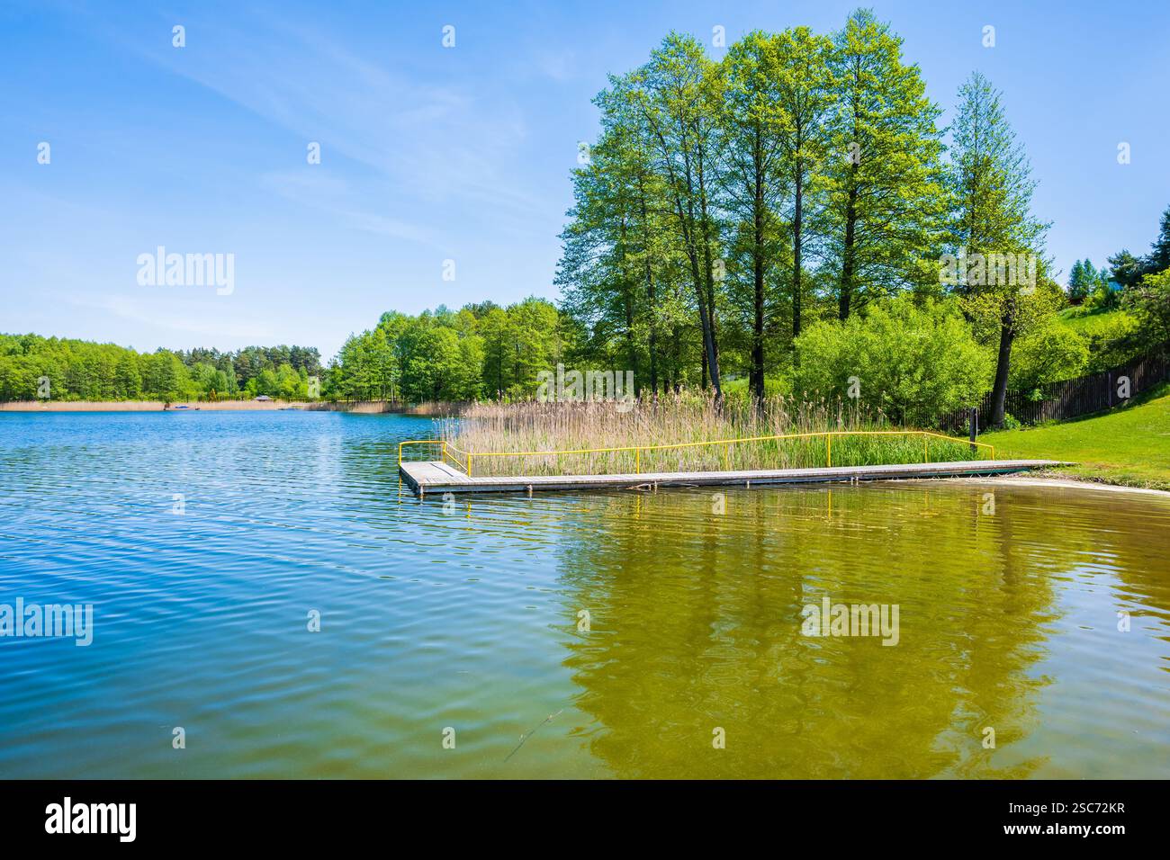 View of beach and pier of Wigry lake in Bryzgiel village, Wigry ...