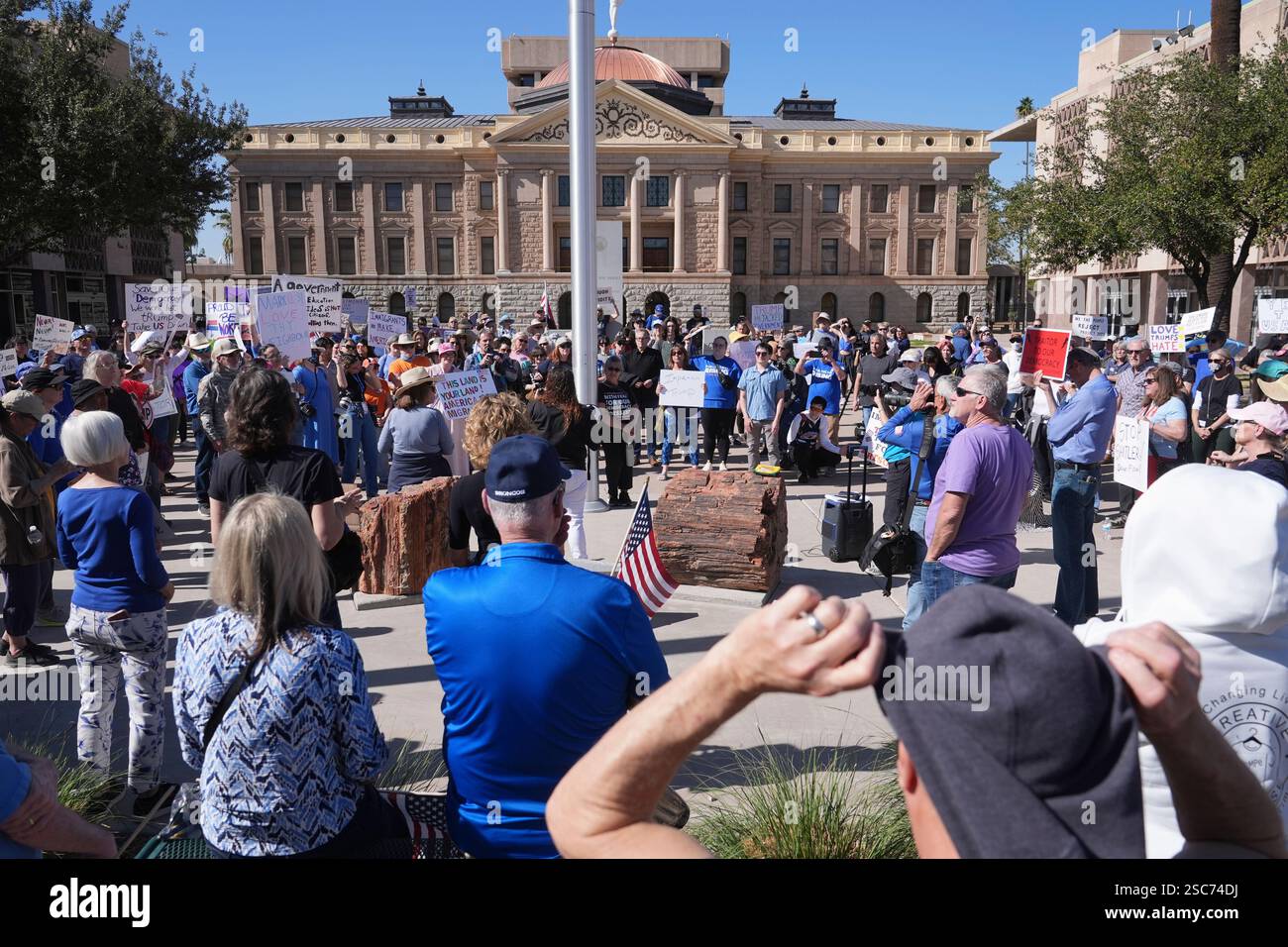 Hundreds gather during a political protest at the Arizona Capitol ...