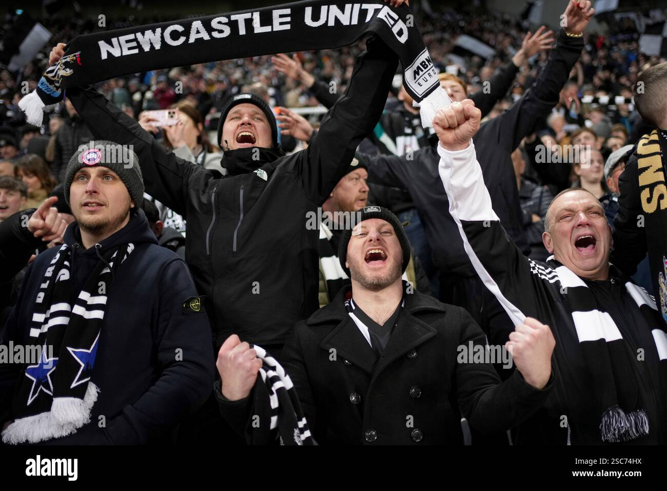 Newcastle supporters celebrate after the English League Cup soccer ...