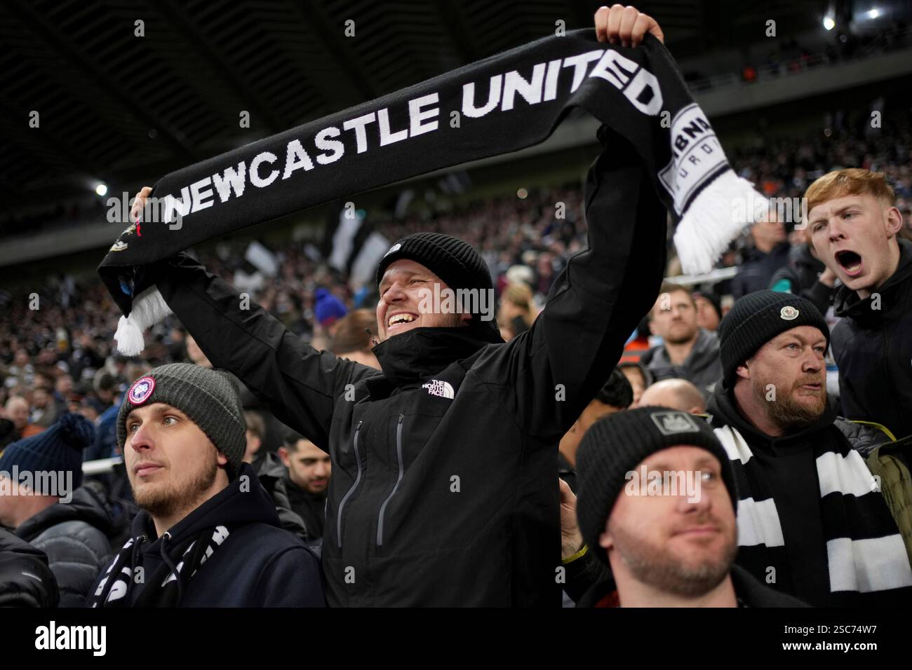 Newcastle supporters celebrate after the English League Cup soccer ...