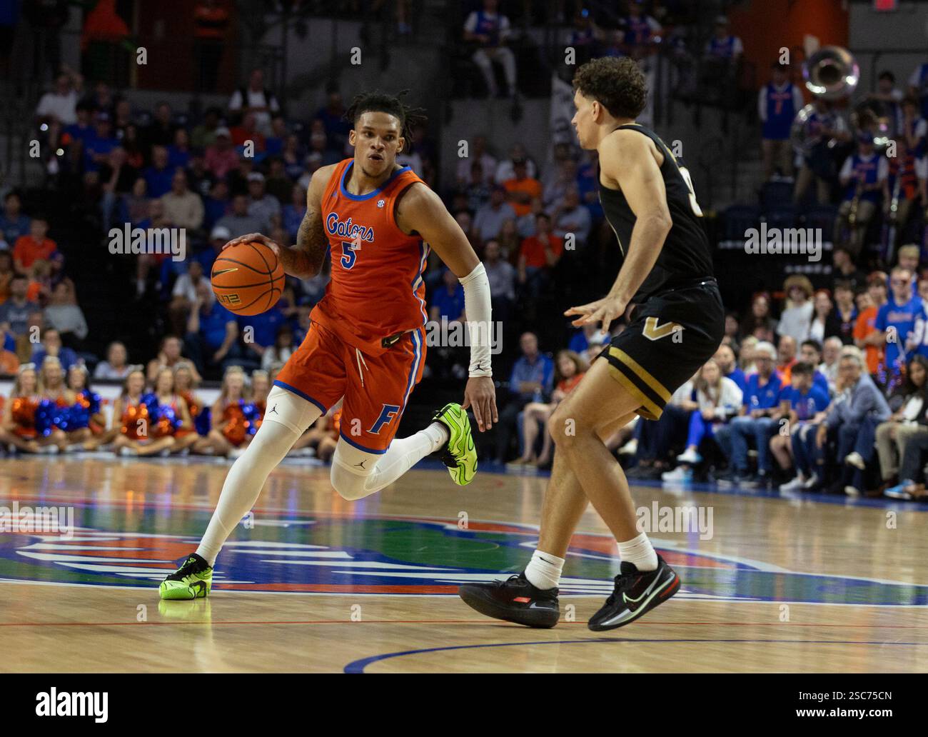 Florida guard Will Richard (5) drives against Vanderbilt guard Chris ...