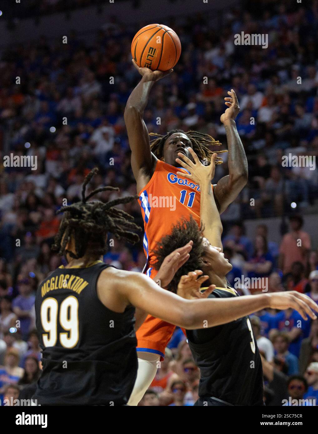 Florida guard Denzel Aberdeen (11) shoots over Vanderbilt forward Devin ...