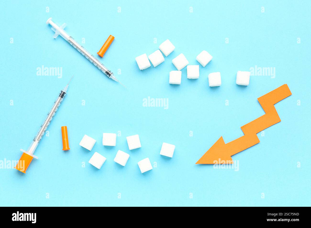 Frame made of sugar with syringes for insulin injection and arrow ...