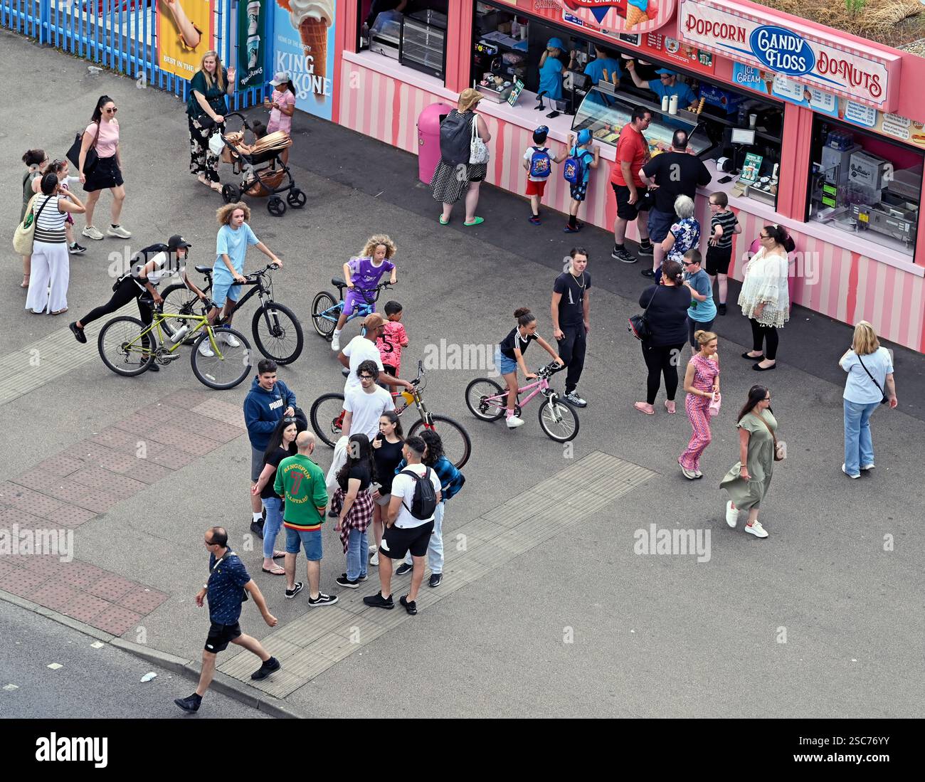 Several cyclists and other passers-by in Western Esplanade outside ...