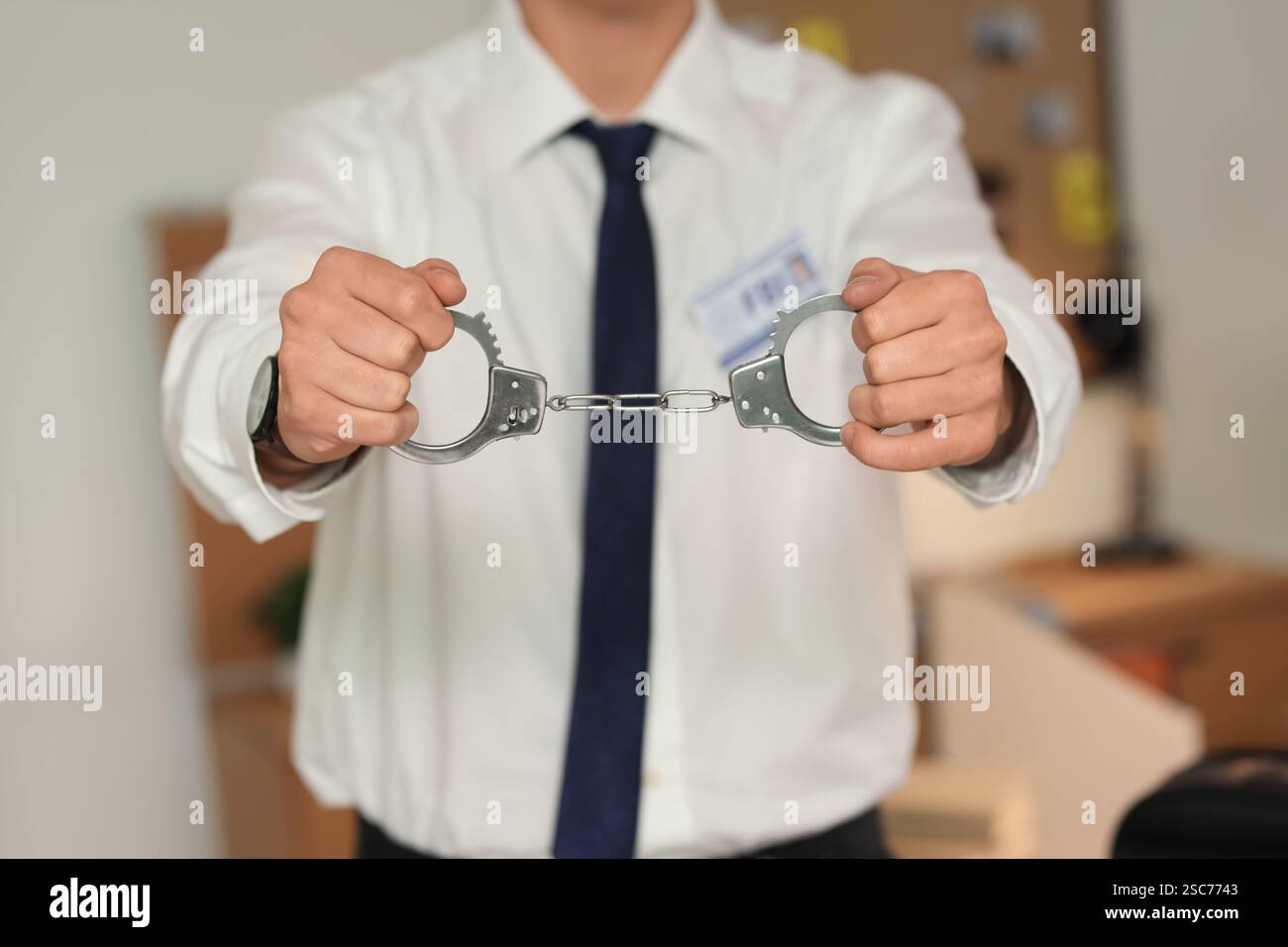 Male FBI agent with handcuffs in office, closeup Stock Photo - Alamy